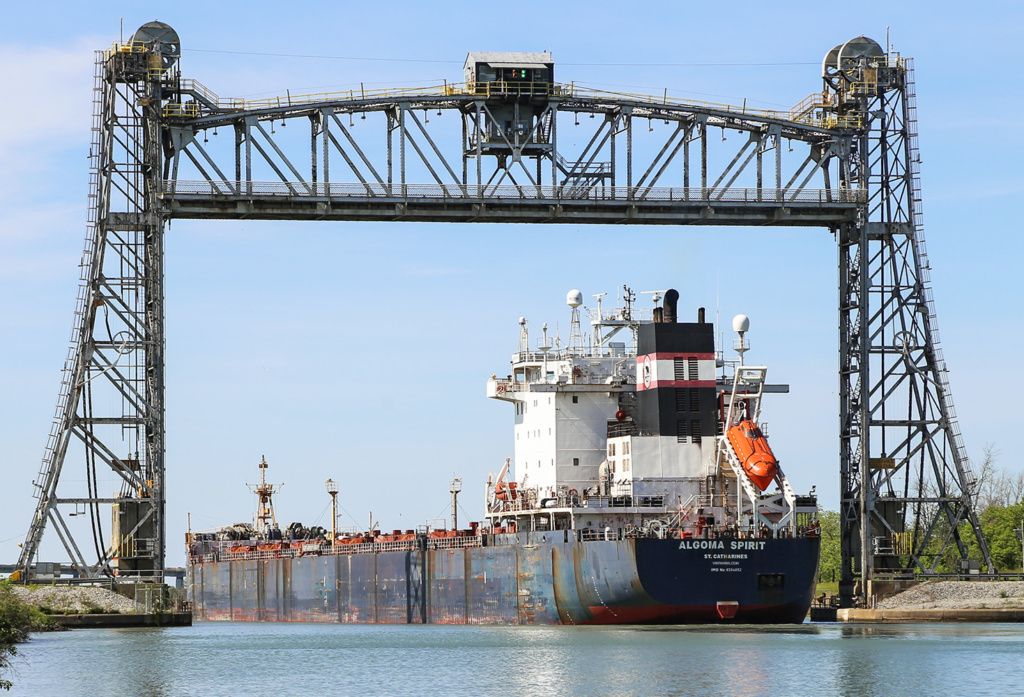 20170620. A 222m cargo ship passes under a 9-panel rivet-connected ...